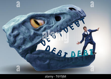 Businessman in the jaws of debt and loan Stock Photo - Alamy