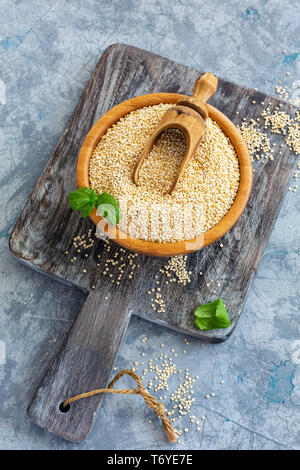 Organic quinoa seeds in wooden bowl - Chenopodium quinoa Stock Photo ...
