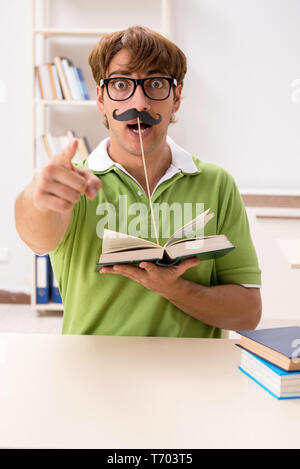 The student with fake moustache reading book Stock Photo - Alamy