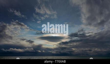 Winter seascape with stormy waves over pier and beacon in the middle of ...
