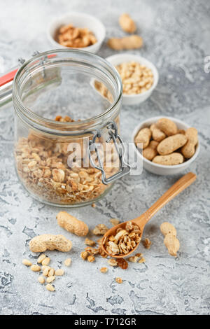 Roasted Brazil nuts on white surface Stock Photo - Alamy