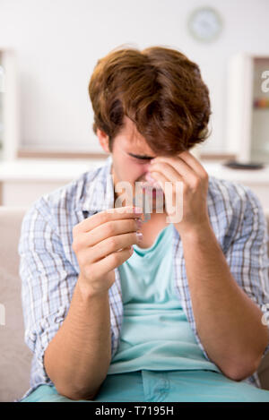 The young man committing suicide with razor blade Stock Photo - Alamy
