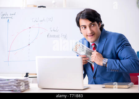 Busy businessman explaining business charts Stock Photo - Alamy