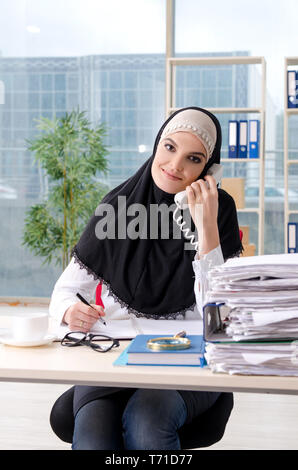Employee, documents and Muslim woman writing, contract and planning ...
