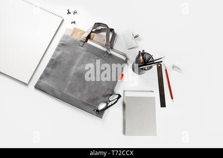Gray shopping canvas bag and stationery on white paper background Stock ...