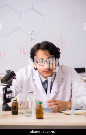 Young funny science man in red glasses Stock Photo - Alamy