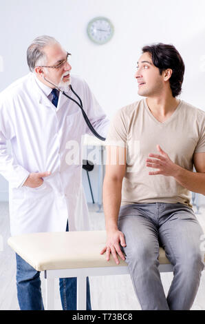 Young patient visiting old male doctor radiologist Stock Photo - Alamy