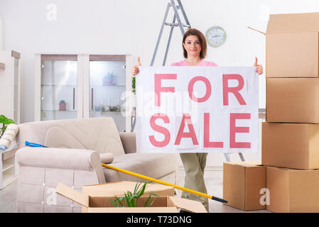 Middle-aged woman selling renovated flat Stock Photo - Alamy