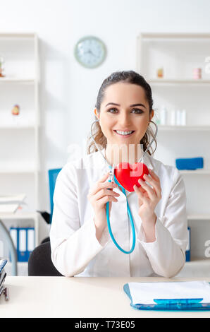 Female doctor cardiologist working in the clinic Stock Photo - Alamy