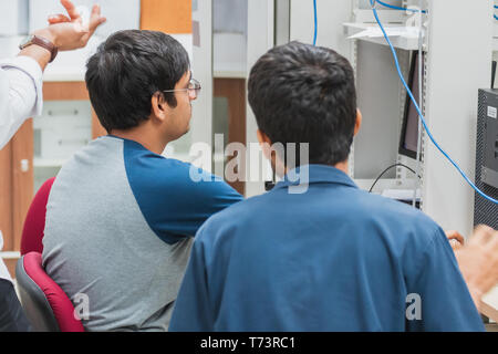 Group of Indian university computer engineering students working and ...