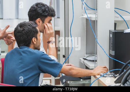 Group of Indian university computer engineering students working and ...