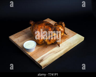 fried chicken entirely on a wooden stand alone Stock Photo - Alamy