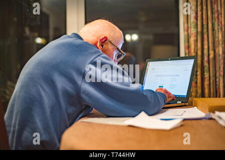 Difficult technology for a man elderly Stock Photo - Alamy
