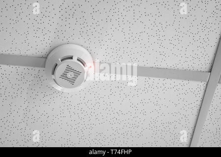 Smoke fire and a carbon monoxide alarm mounted on the ceiling Stock ...