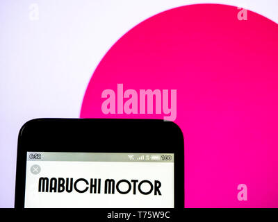 In this photo illustration a Mabuchi Motor Company logo seen displayed ...