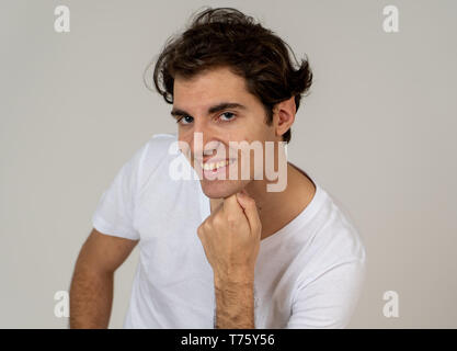 Close up portrait of carefree outgoing male student in casual blue t ...