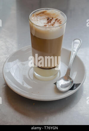 Delicious coffee in glass cup isolated on white Stock Photo - Alamy
