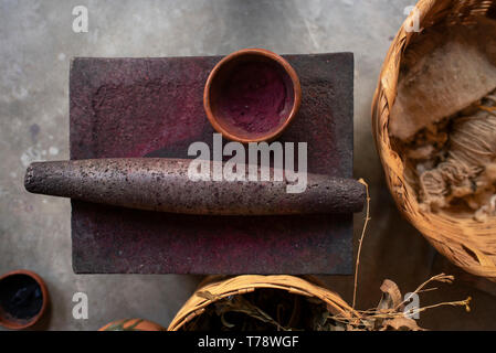 Dried cochineal insects are ground to make a natural red dye for dying ...