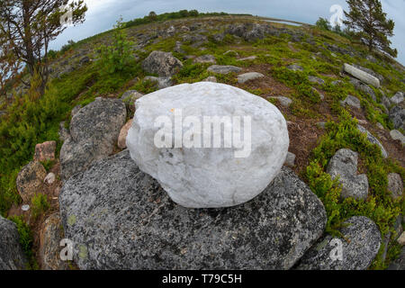 Large quartz boulder in the tundra on the shore of the White Sea Stock ...