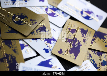 Many bank cards scattered on table Stock Photo - Alamy