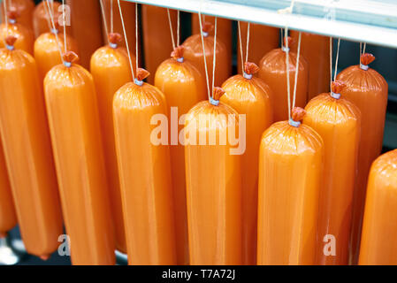 Sausages. Packing line of sausage. Industrial manufacture of sausage ...