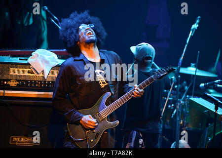 Guitar player Rocky George with Fisbone, alongside trombone player Jay ...