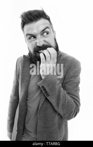 Man bearded hipster doubtful face bites finger while thinking. Nervous ...