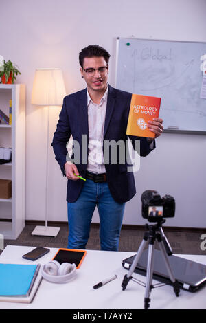 smiling tutor man in glasses with laptop. adult student study online ...