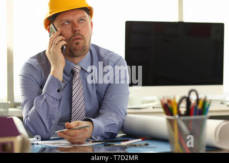 Construction Worker Sit in Engineering Office Stock Photo - Alamy
