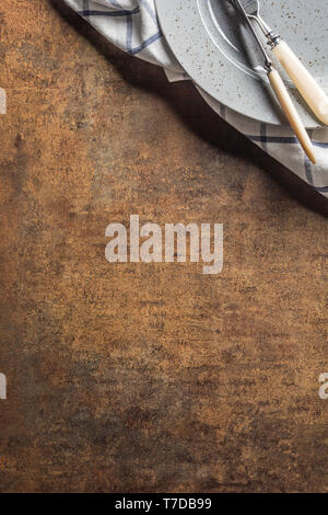 knife and fork at napkin on wooden background Stock Photo - Alamy