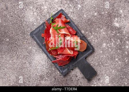 Traditional spanish jamon, prosciutto crudo, italian salami, parma ham ...