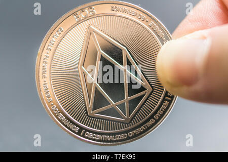 EOS, crypto currency coins, blockchain digital money Stock Photo - Alamy