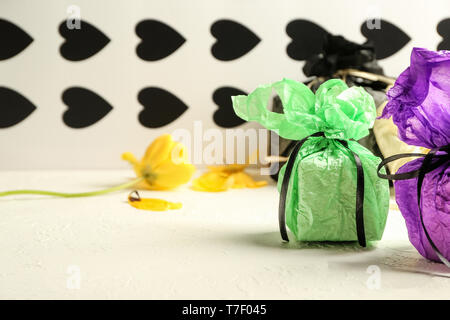 Stylish gifts on table Stock Photo - Alamy