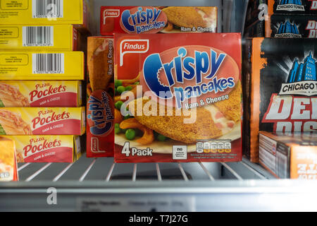 A pack of four Findus Crispy pancakes on a shelf in a freezer unit in a ...