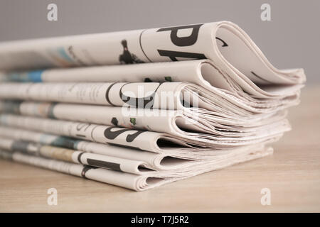 Pile of various newspapers on table Stock Photo - Alamy