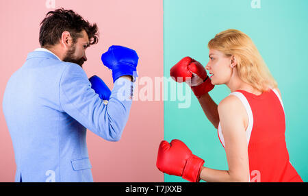 Gender battle. Gender equal rights. Family quarrel. Boxers fighting in ...