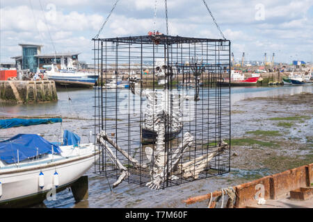 Skeleton in a cage Stock Photo - Alamy