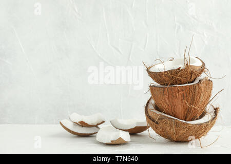 Stack tropical coconut on wooden table against white background Stock ...