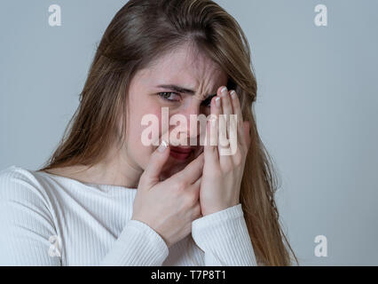 Portrait of attractive scared girl hiding face look horror movie ...