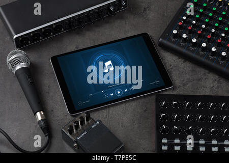 Playing song on tablet with electronic music instruments around Stock ...