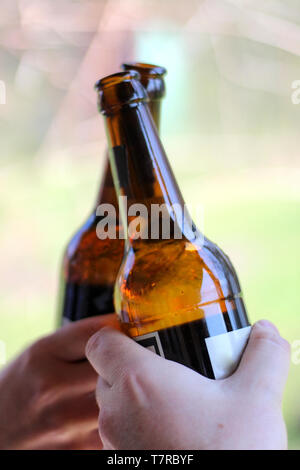 crossed beer bottles Stock Photo - Alamy