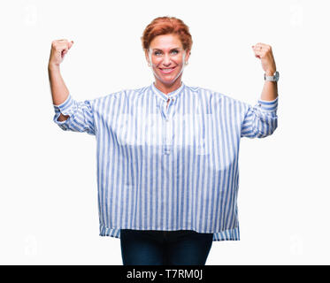 Atrractive senior caucasian redhead woman wearing winter sweater over ...