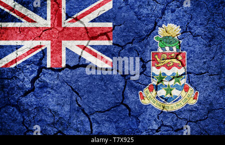 Flag of the Cayman Islands on dry earth ground texture background Stock ...