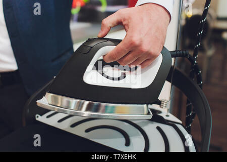 Father ironing child’s clothes Stock Photo - Alamy