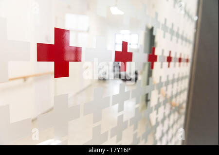 Red crosses on a glass door of a waiting room in a hospital Stock Photo ...