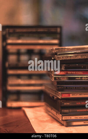 Hi-Fi headphones on stack of CDs on black background with copy space ...