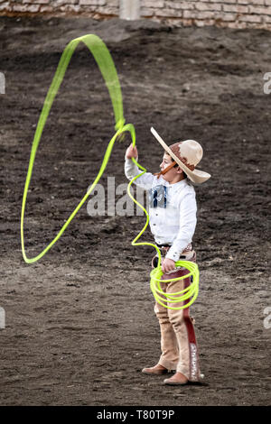 A Mexican charro practices his lasso at the National Charro ...