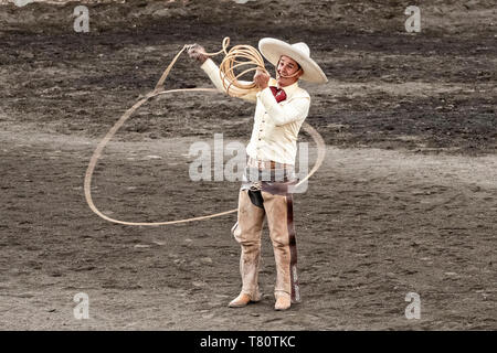 A Mexican charro practices his lasso at the National Charro ...