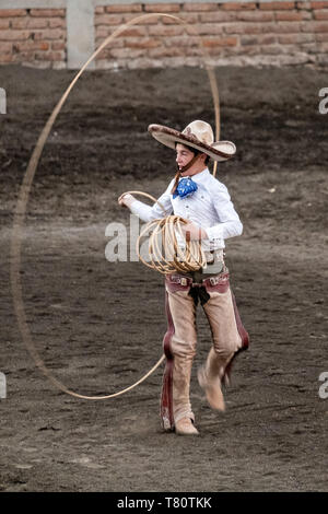 A Mexican charro practices his lasso at the National Charro ...