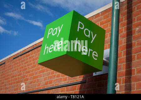 Waitrose Supermarket car park 'Pay Here' signs Stock Photo - Alamy